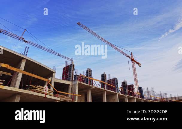 This aerial perspective showcases a construction site with cranes ...