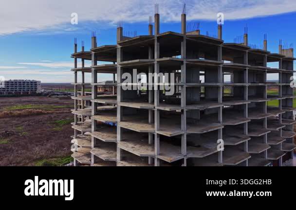 An aerial view reveals a partially constructed building with exposed ...