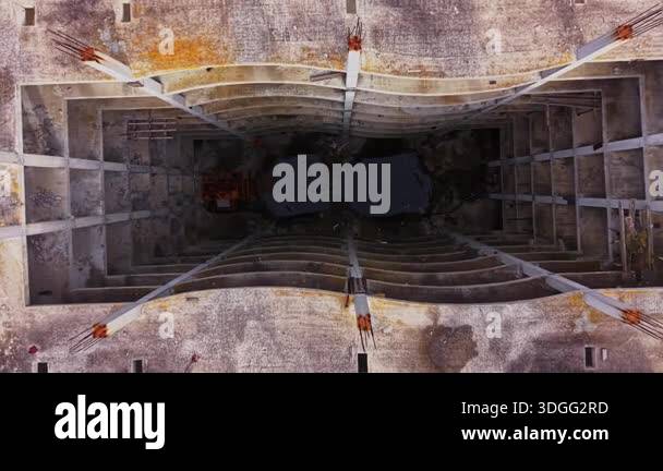 Aerial view of a construction site displaying twisted structural ...