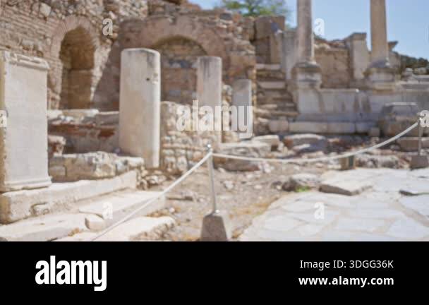 Ancient ephesus ruins defocused background with stone columns and worn ...