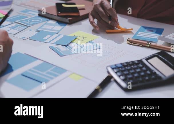 team of UI UX web designer are working together to develop mobile ...