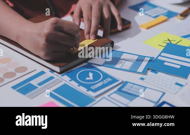 team of UI UX web designer are working together to develop mobile ...