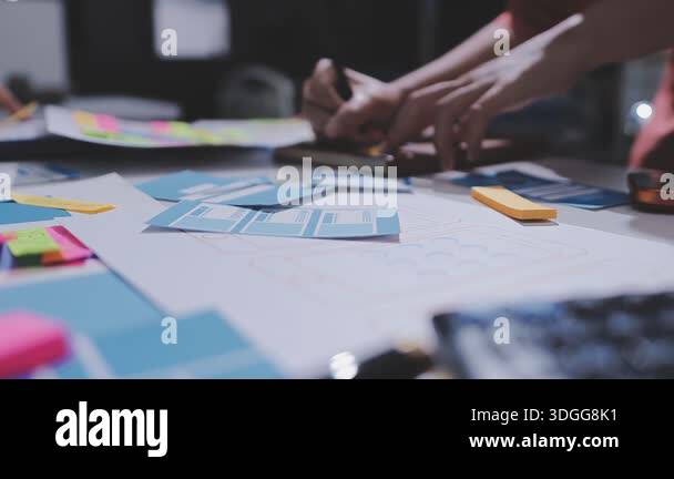 team of UI UX web designer are working together to develop mobile ...