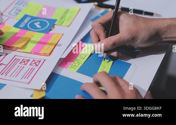 team of UI UX web designer are working together to develop mobile ...