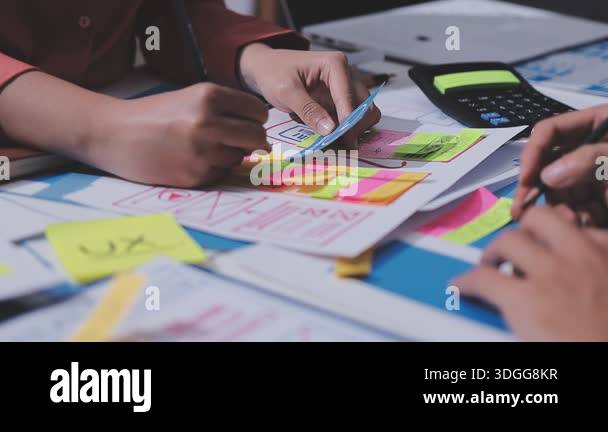 team of UI UX web designer are working together to develop mobile ...