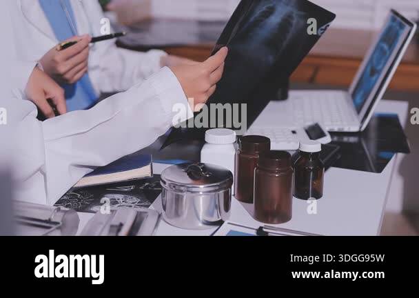 Medical staff team african american meeting discussing chest x-ray film ...