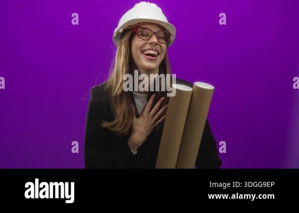 Woman in white hard hat holding cardboard tubes with hand on chest in ...
