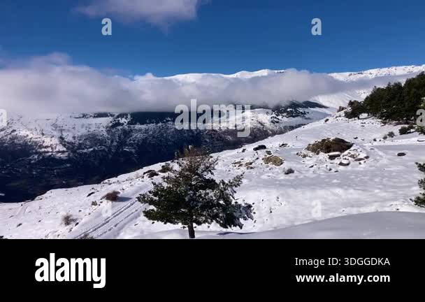 Pristine winter mountain views reveal snow-covered peaks and untouched ...