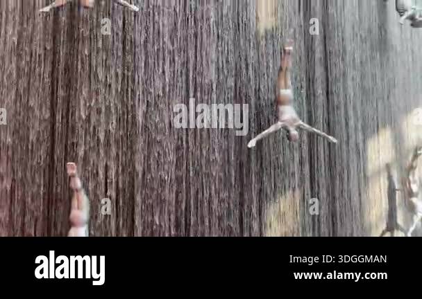 Dubai, UAE. 1 November 2025. Dubai Mall Waterfall and Pearl Divers in a ...