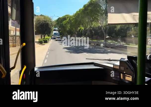 Floriana, Malta - June 1, 2025: A bus approaching a digital sign with ...