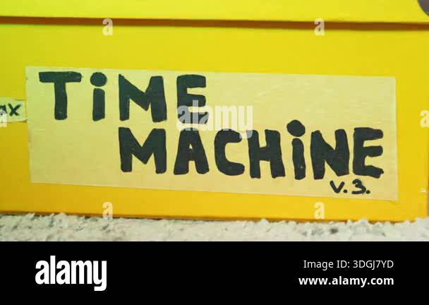 hand-drawn label with words TIME MACHINE v.3 in black ink is attached ...