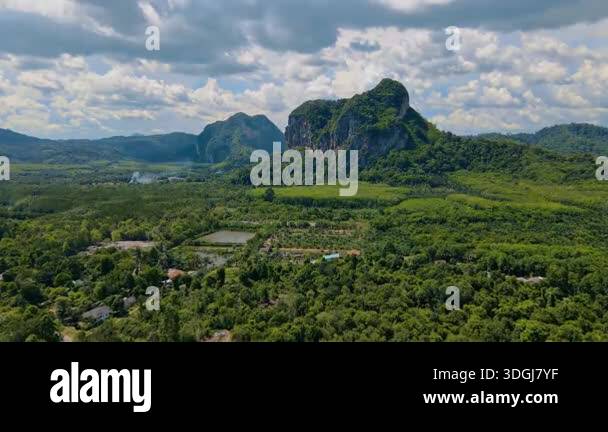 Lush Karst Mountain Over Emerald Forest, Sweeping Aerial View Of Krabi ...
