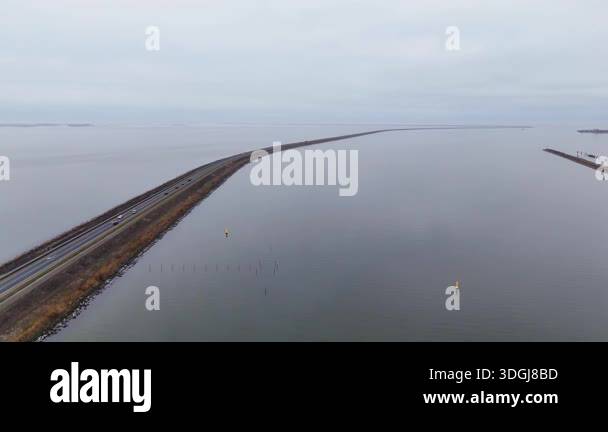 Aerial Curved Causeway Over Tidal Waters, Civil Engineer Surveying ...