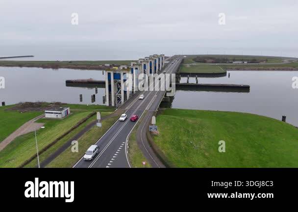 Aerial Bridge Floodgate Roadway With Vehicles, Trucks And Cars Moving ...