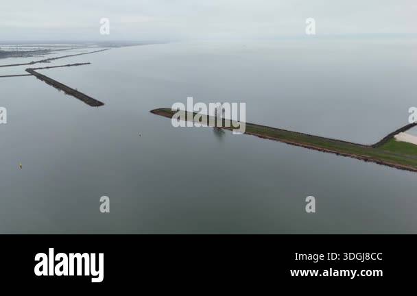 Aerial Wind Turbine On Narrow Spit, Environmental Engineer Inspecting ...