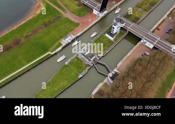 Canal Lock Aerial View Showing Bascule Bridge, Boats In Lock, Control ...