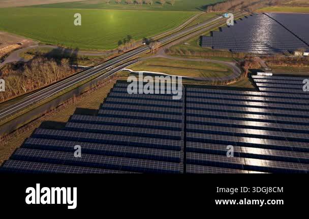 Aerial Solar Farm By Country Road Morning Sunlight Reflecting Off Panel ...