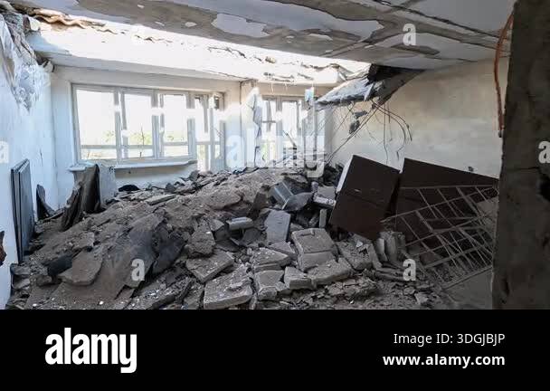 POV walking through a destroyed building showing holes in the roof ...