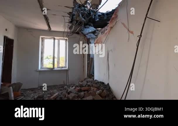Extensive structural damage to a residential building featuring holes ...
