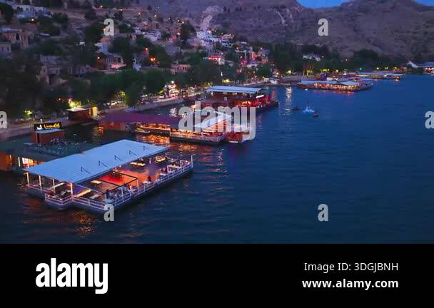 Flyboard rider performs tricks in warm evening glow Stock Video Footage ...