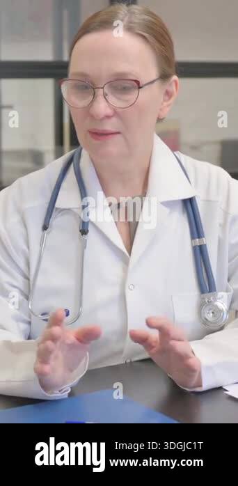 Old Lady Doctor Talking with Young Woman, vertical video Stock Video ...