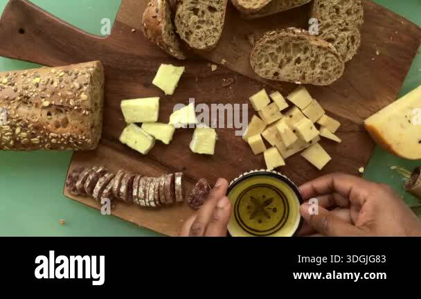 Slices of bread cheese olives and salami Stock Video Footage - Alamy