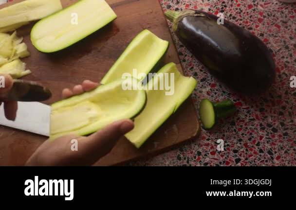 person preparing zucchini dish, top view Stock Video Footage - Alamy