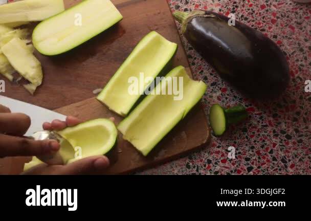 person preparing zucchini dish, top view Stock Video Footage - Alamy