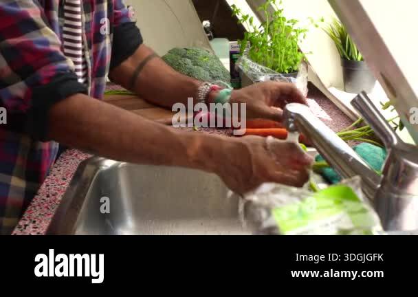 Close up person washing veggies before cooking Stock Video Footage - Alamy