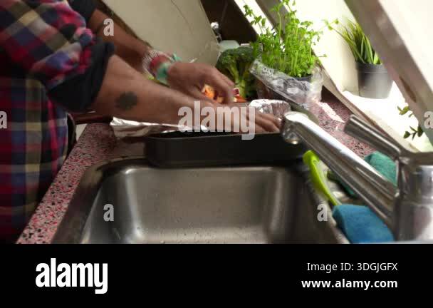 Hands preparing food near kitchen sink Stock Video Footage - Alamy
