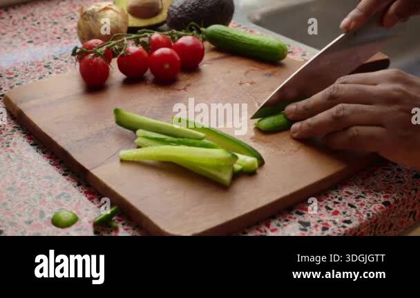 Person hands preparing veggies on wooden chopping board Stock Video ...
