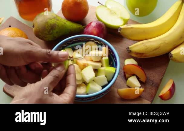 Closeup chef preparing healthy fruit salad at home Stock Video Footage ...