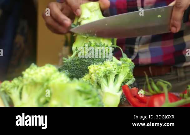 Close up of person chopping broccoli for healthy meal Stock Video ...