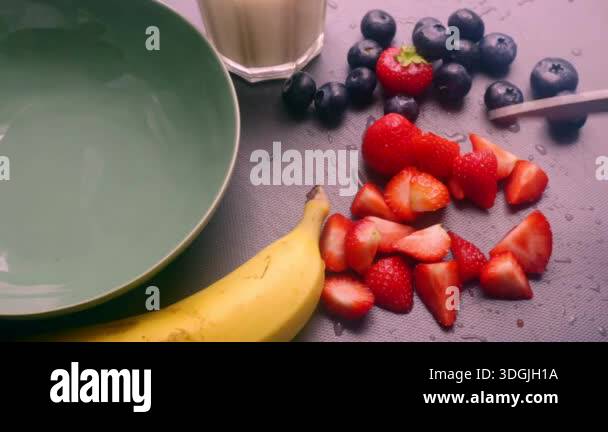 Person hands preparing fruits for morning breakfast cereal Stock Video ...