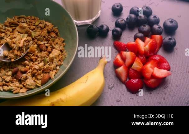 Person hands preparing healthy muesli cereal for breakfast Stock Video ...