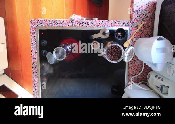 espresso coffee being prepared with moka pot on electric stove Stock ...