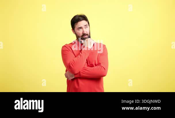 Pensive casual man thinking deeply and finally having a great idea on a ...