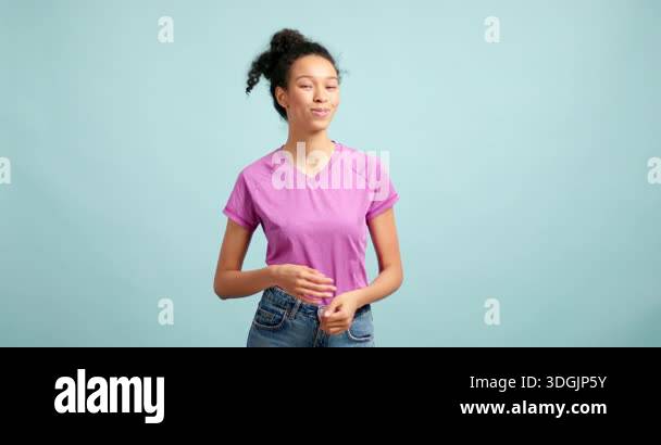 Young sarcastic african american woman clapping hands with a skeptical ...
