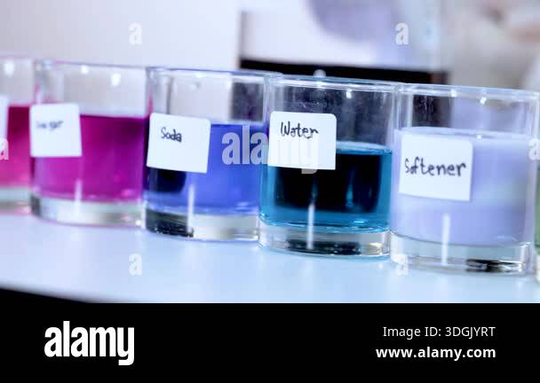 Color changes in liquids using pH indicators Stock Video Footage - Alamy
