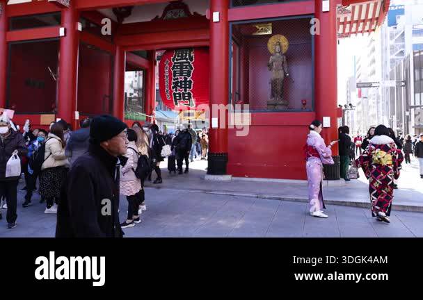 Visitors exploring the iconic Sensoji Temple gate Stock Video Footage ...