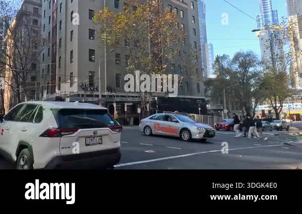 Traffic and pedestrians in Melbourne city intersection Stock Video ...