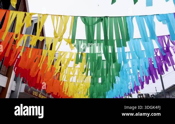Vibrant flags fluttering in Krabi, Thailand Stock Video Footage - Alamy