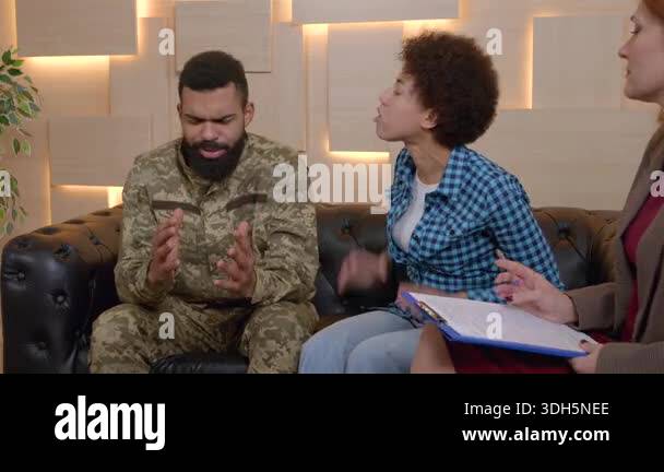 Frustrated African American woman and irritated black male army soldier ...