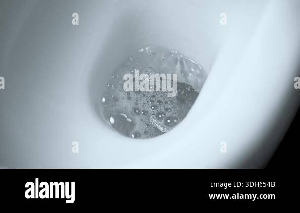 Water flowing in a clean white toilet bowl. Slow motion Stock Video ...