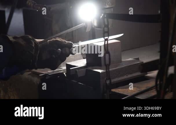 A craftsman stamping a knife Stock Video Footage - Alamy