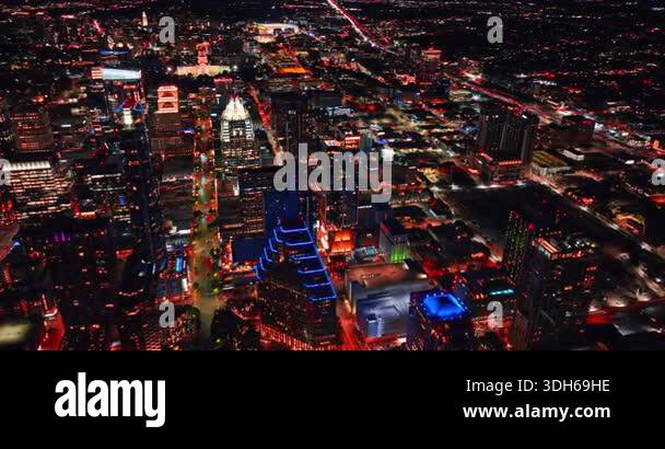 Footage over the dazzling scenery of Austin, Texas, USA at night ...