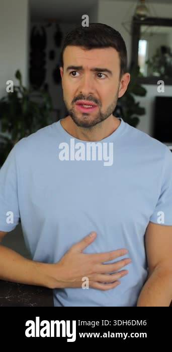 handsome Man gesturing wearing blue shirt indoors Stock Video Footage ...