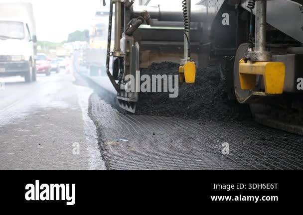 Special machinery making road in countryside area. Compactor ...