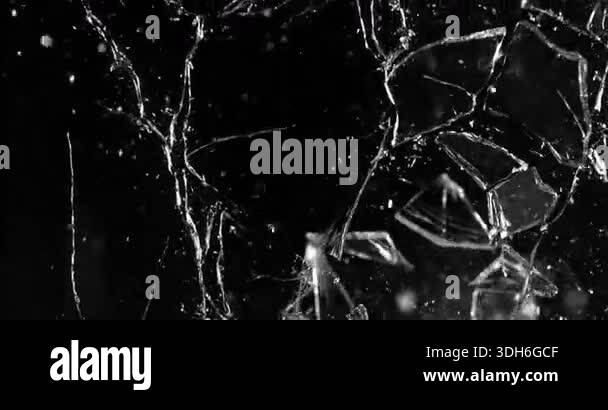 Front view of glass shattered by a bullet in super slow motion (1000fps ...