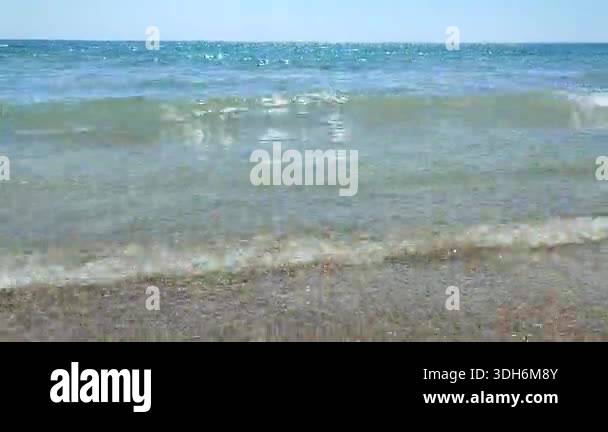 Beautiful sea waves with turquoise transparent water rolling onto sand ...